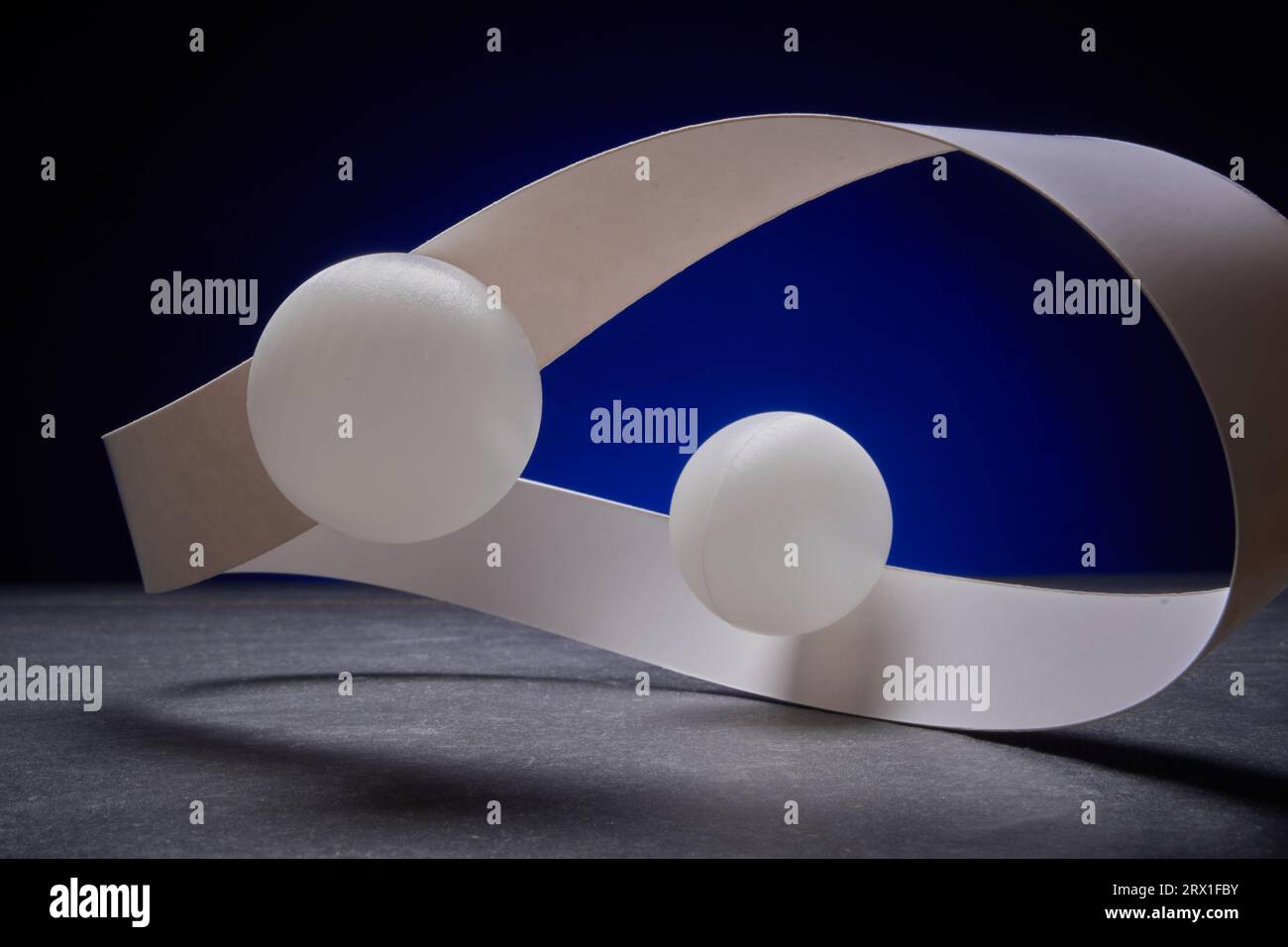 Mobius strip with spheres running the circuit Stock Photo - Alamy