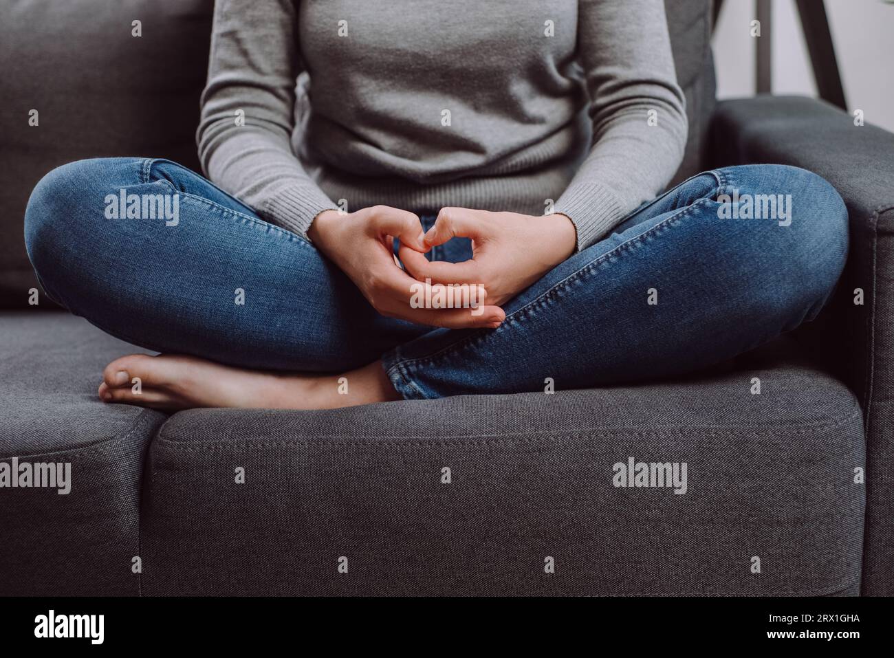 Hands hugging knees hi-res stock photography and images - Alamy