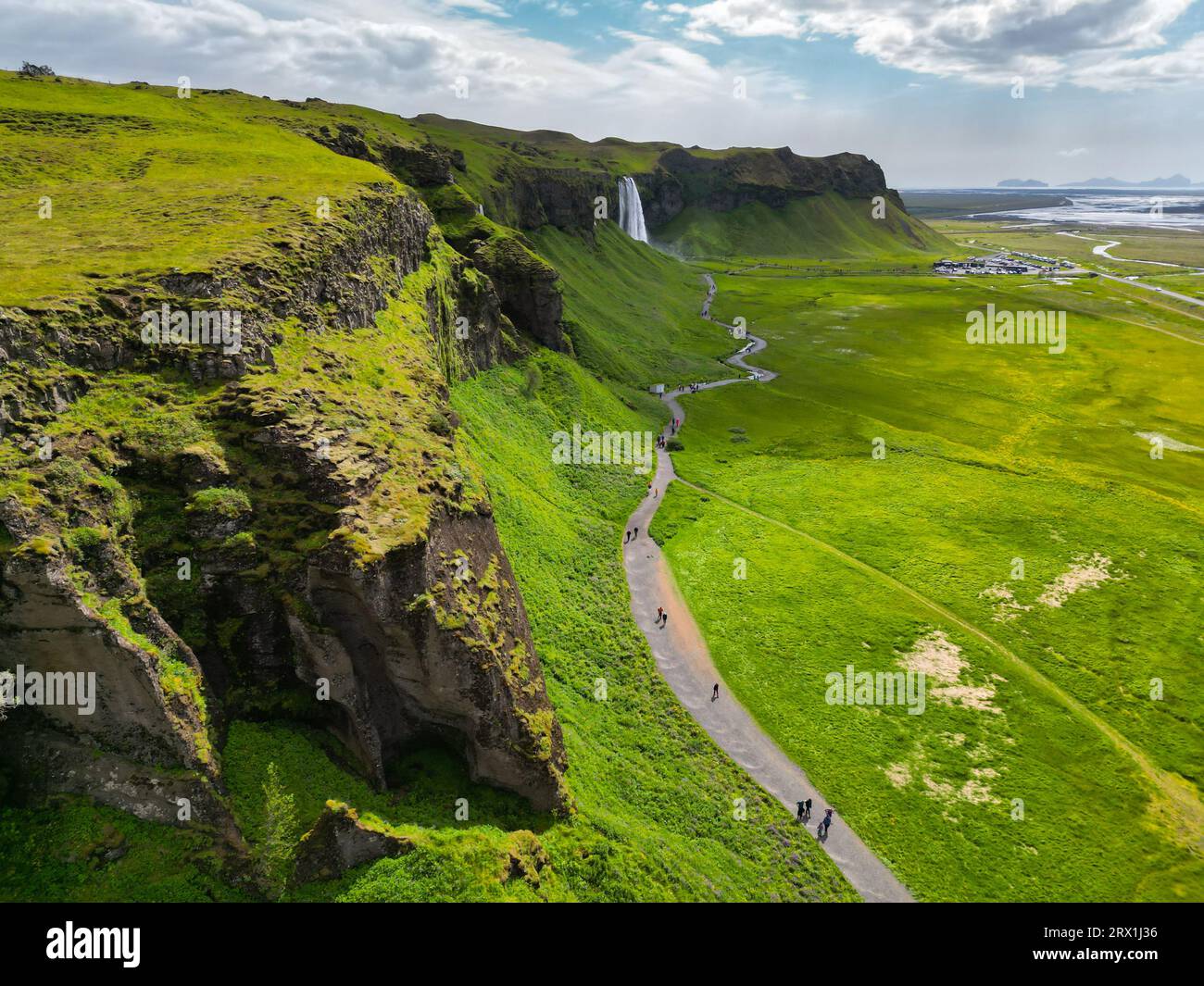 Seljalandsfoss waterfall sorrounded by green grass and moss Stock Photo ...