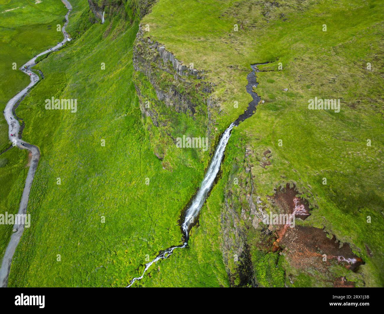 Seljalandsfoss waterfall sorrounded by green grass and moss Stock Photo ...