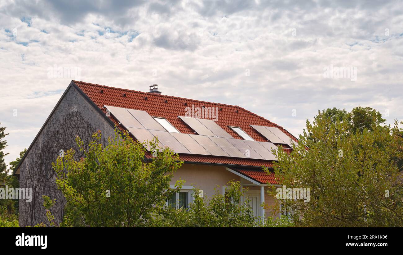 Solar photovoltaic panels on house roof. Modern country house with self ...