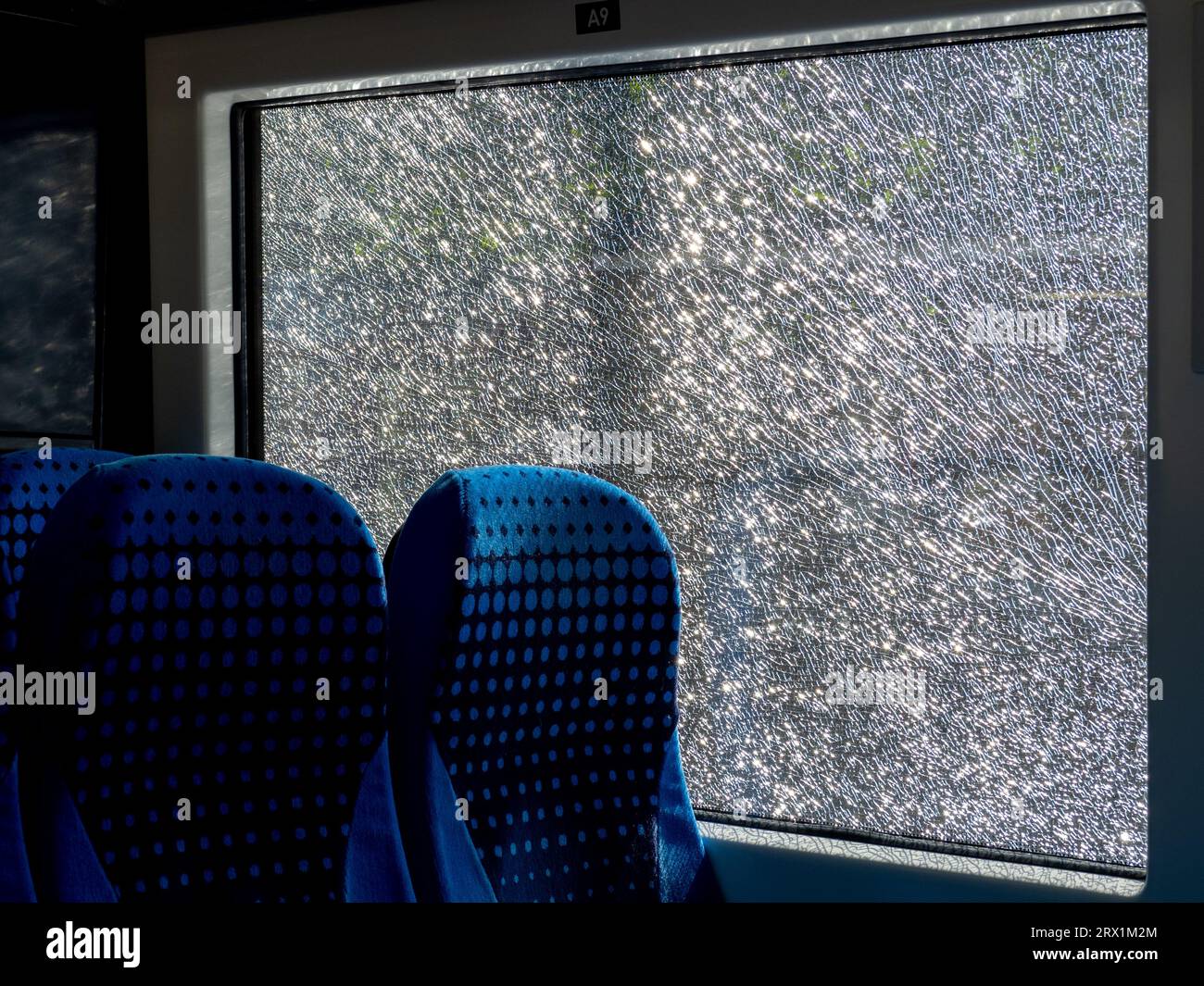 A shattered train window Stock Photo - Alamy