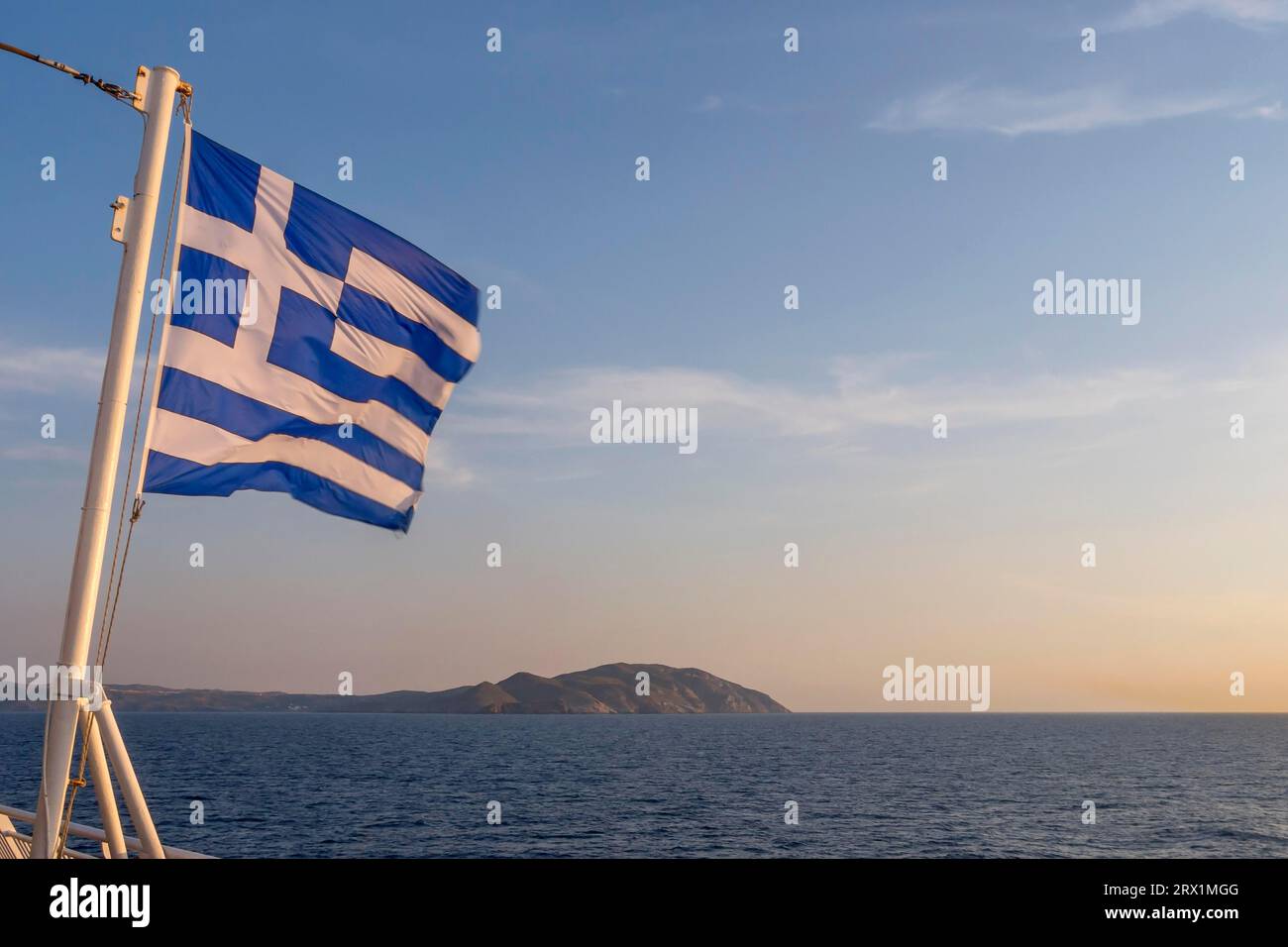 Greek flag waving in the wind, evening light, Greece Stock Photo - Alamy