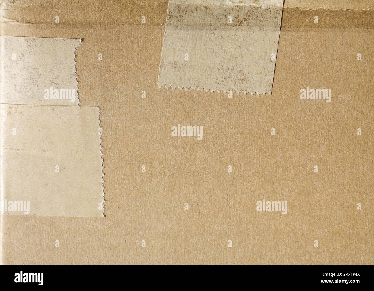 Cardboard background with some adhesive tape Stock Photo - Alamy