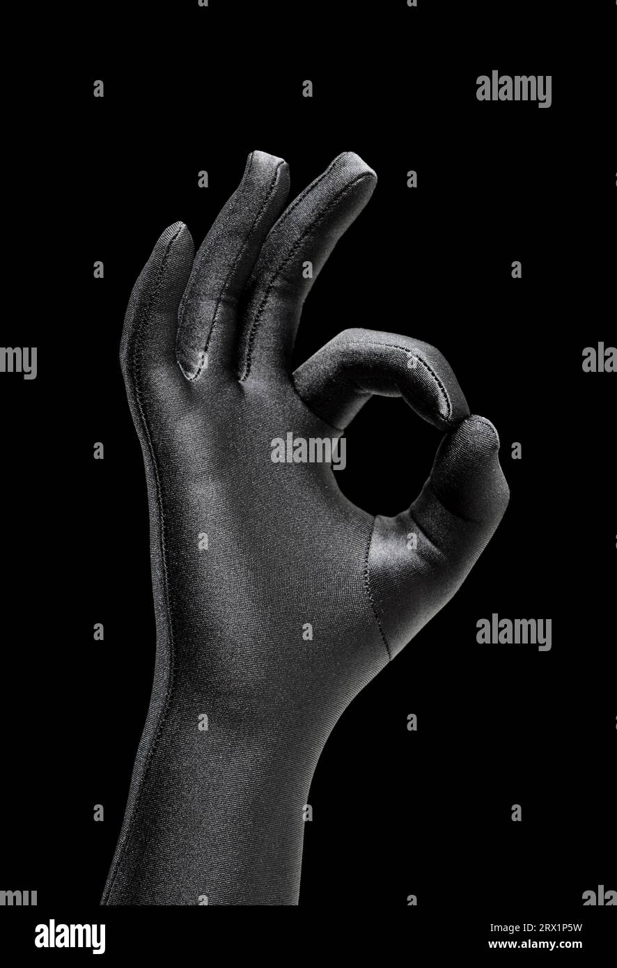 Strange gloved hand doing a OK sign Stock Photo - Alamy