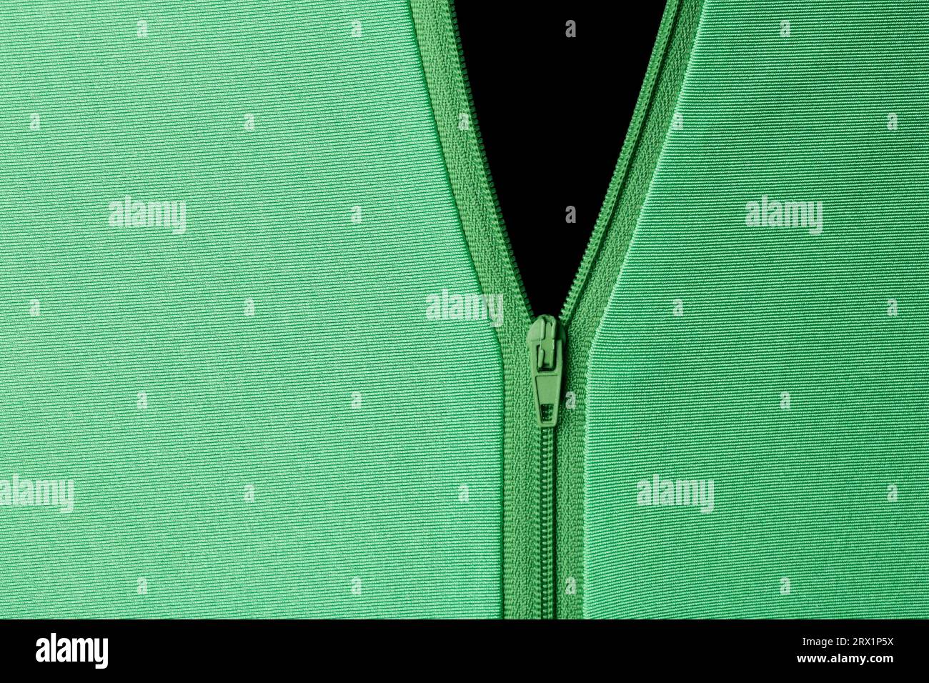 Green opened zipper revealing black background Stock Photo - Alamy