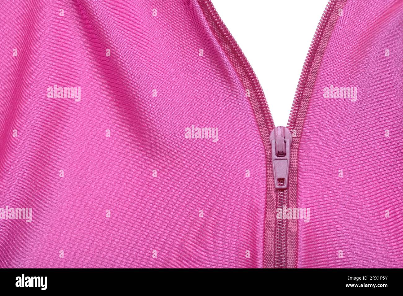 Zipper of a fuchsia colored garment revealing a white surface Stock ...