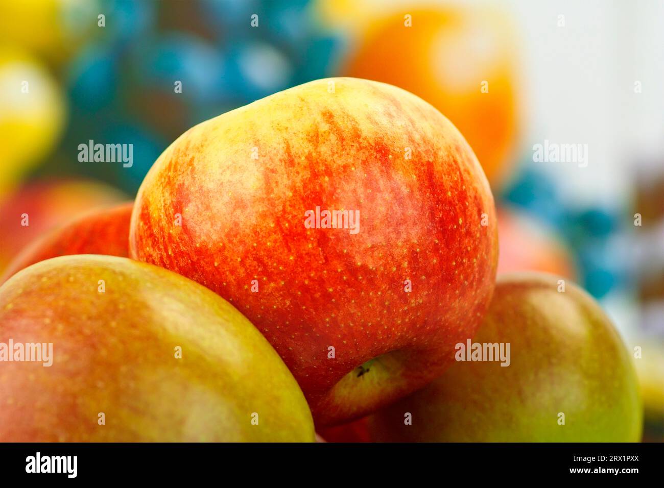 Three apples in front of other fruit Stock Photo - Alamy
