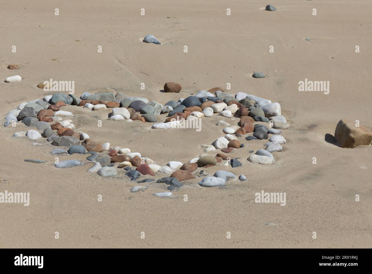 heart made from beach pebbles Stock Photo - Alamy