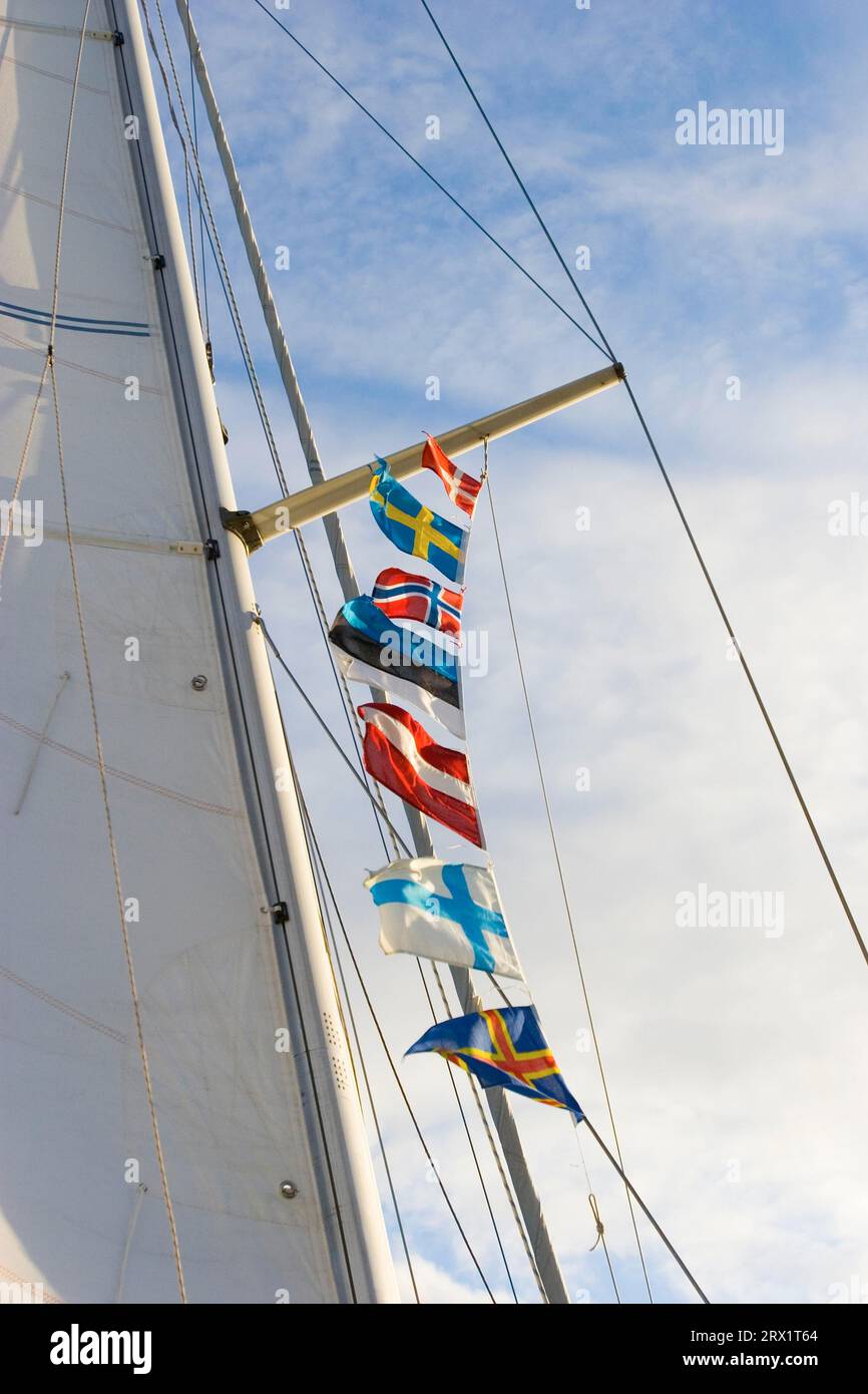 The flags of the countries visited are flying under the starboard ...