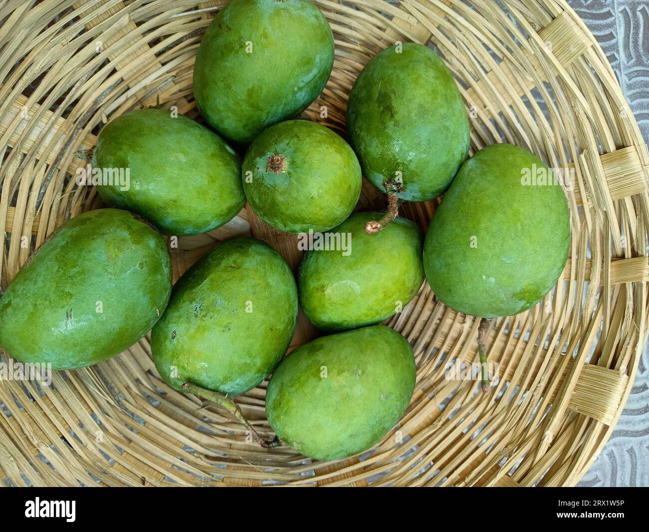 Green mango, in basket in India Summer fruit, indian green mango Stock ...
