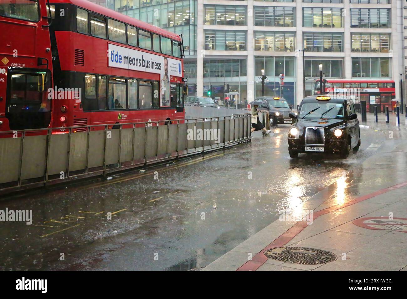 Taxis pulling up at the taxi rank outside Victoria Station during a ...