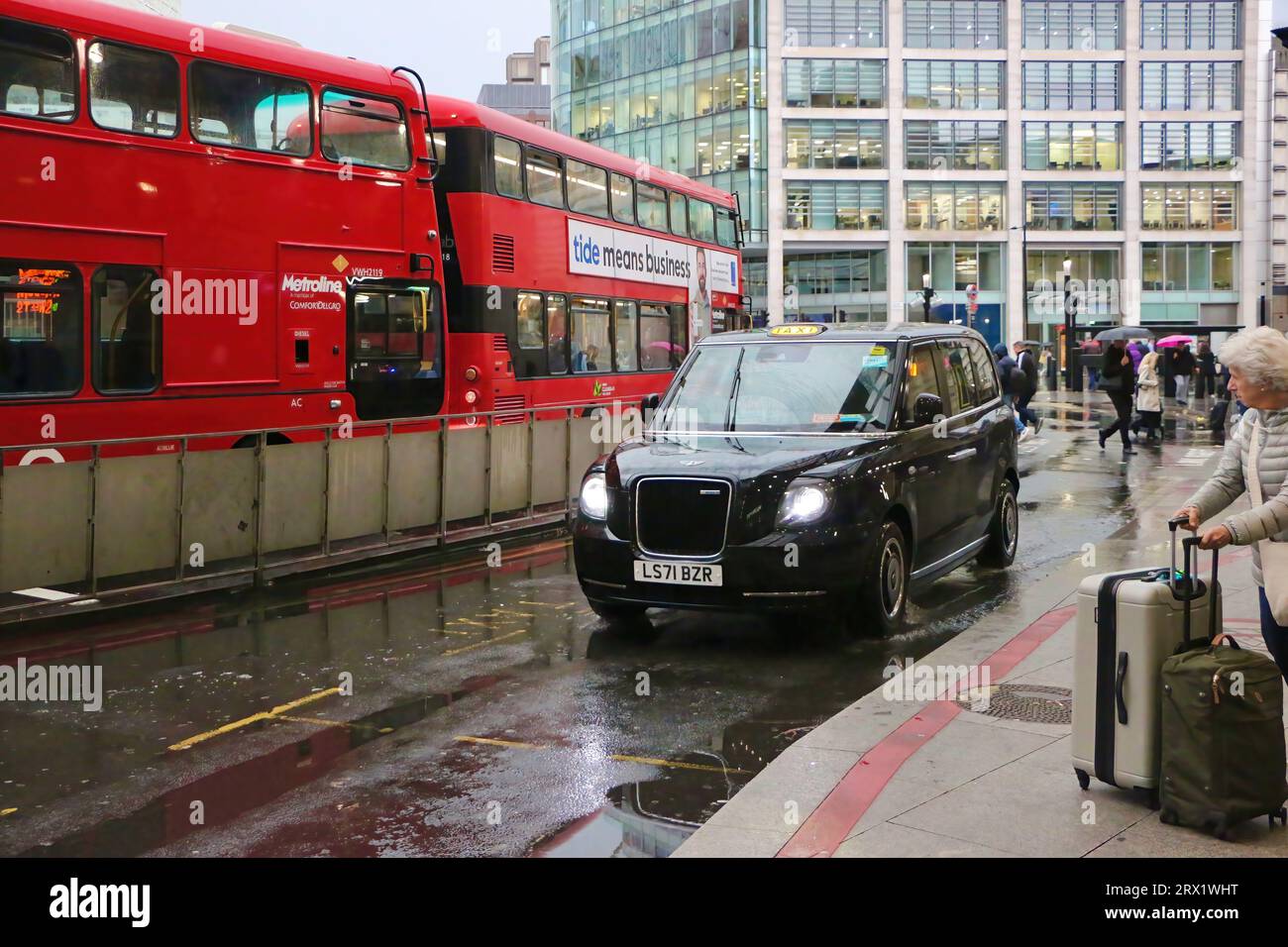 Taxis pulling up at the taxi rank outside Victoria Station during a ...