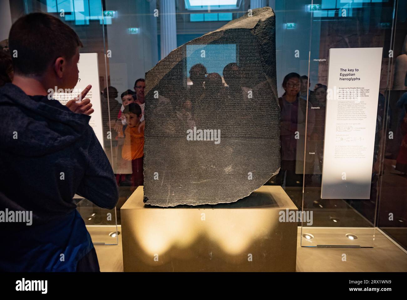 London, UK. 02nd Aug, 2023. Tourists gather round the Rosetta Stone on ...