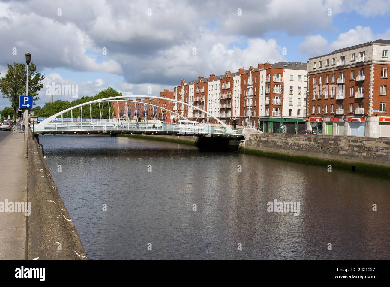James Joyce Bridge over river Liffey and row houses in the city of ...