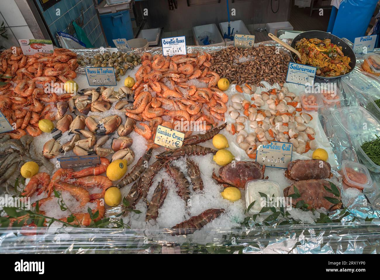Various crabs and shrimps on ice in a fish shop, Paris, France Stock ...