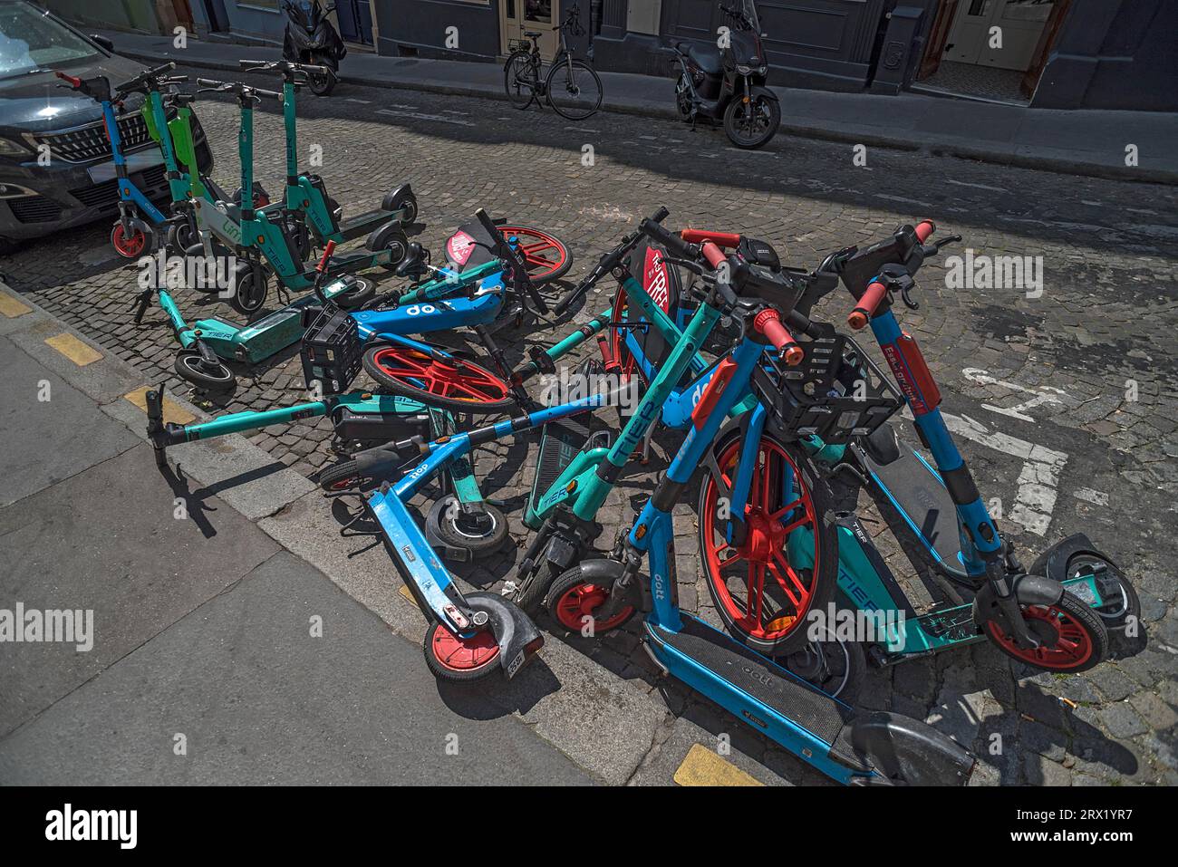 E-scooters thrown on the pile on the street, after the e-scooter ban in ...
