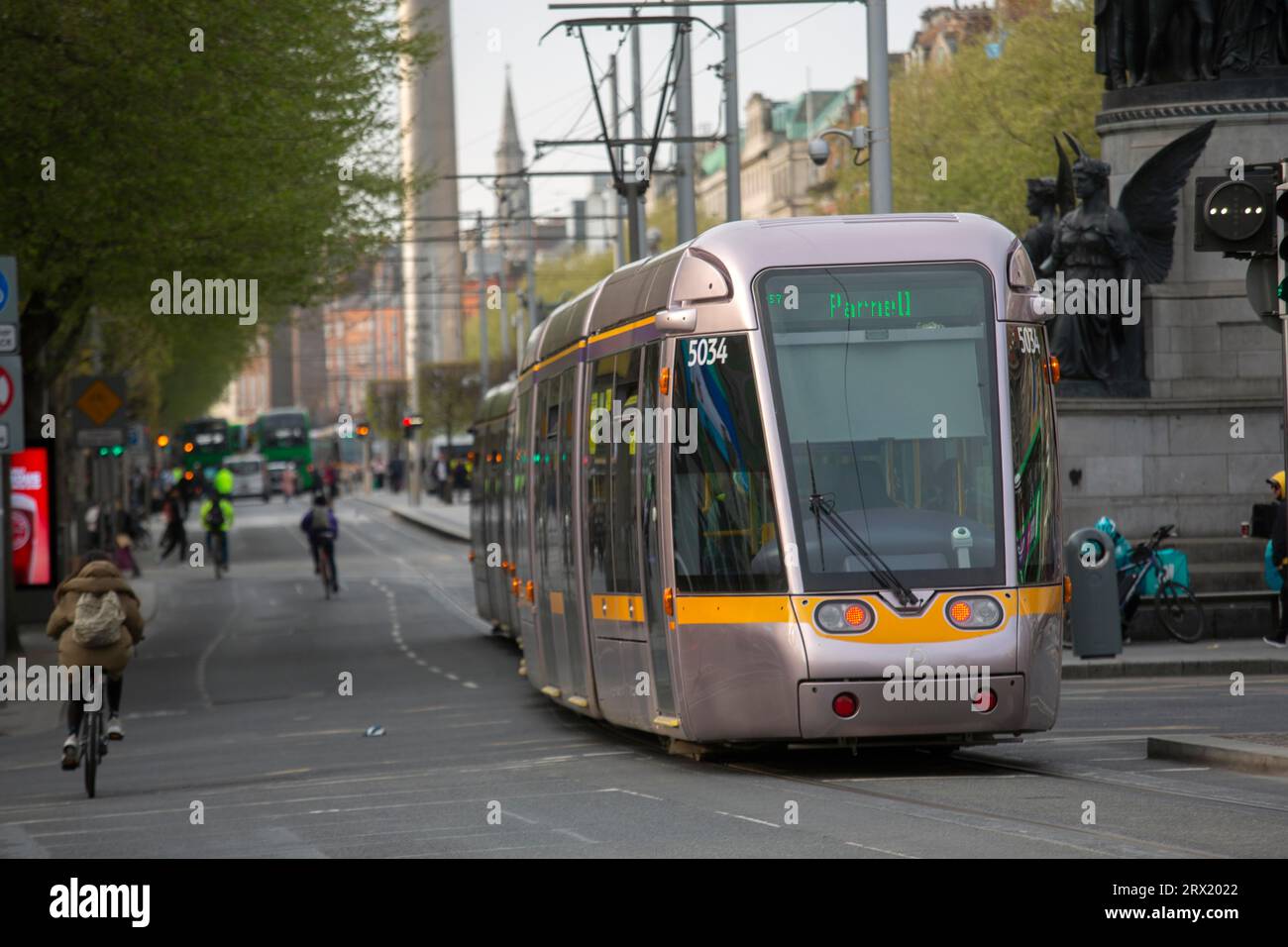 A Luas tram in O'Connell Street with cyclists visible too. Dublin ...