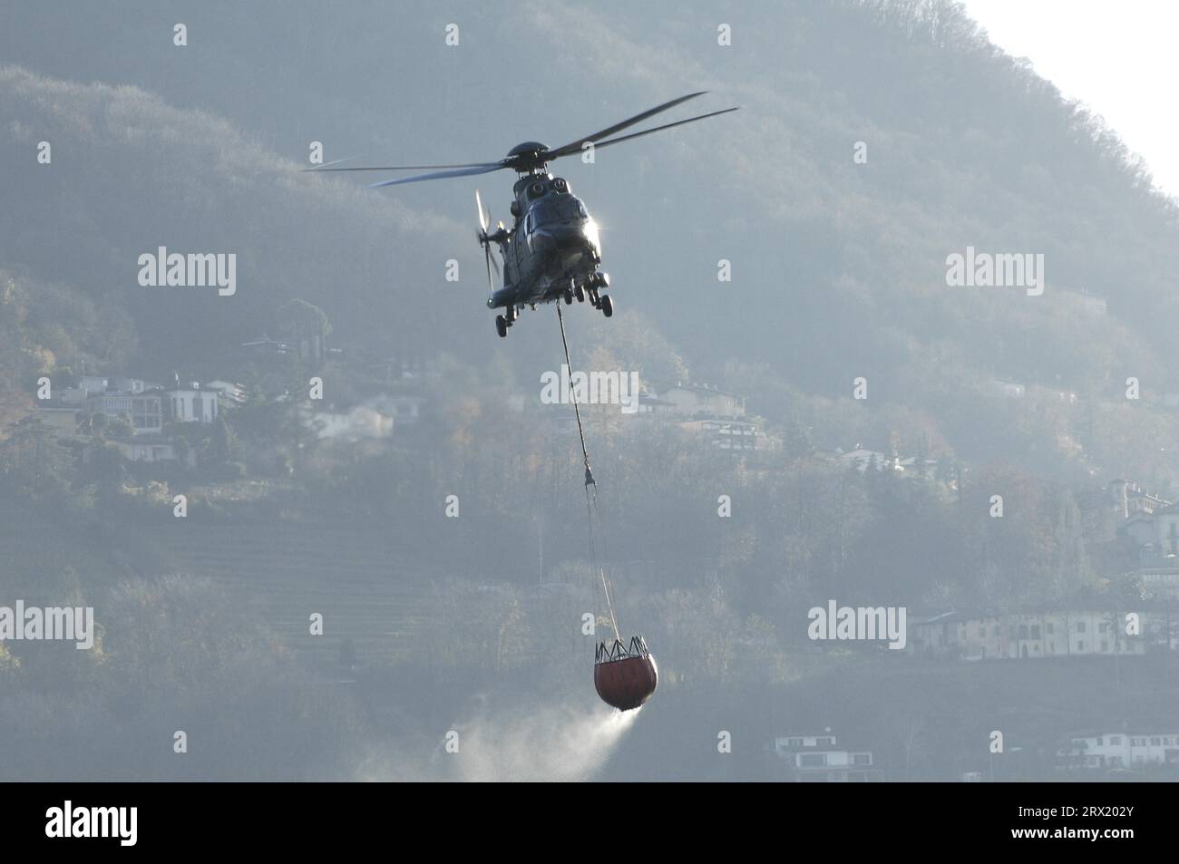 Helicopter, Military Swiss, Fire extinguishing Stock Photo - Alamy