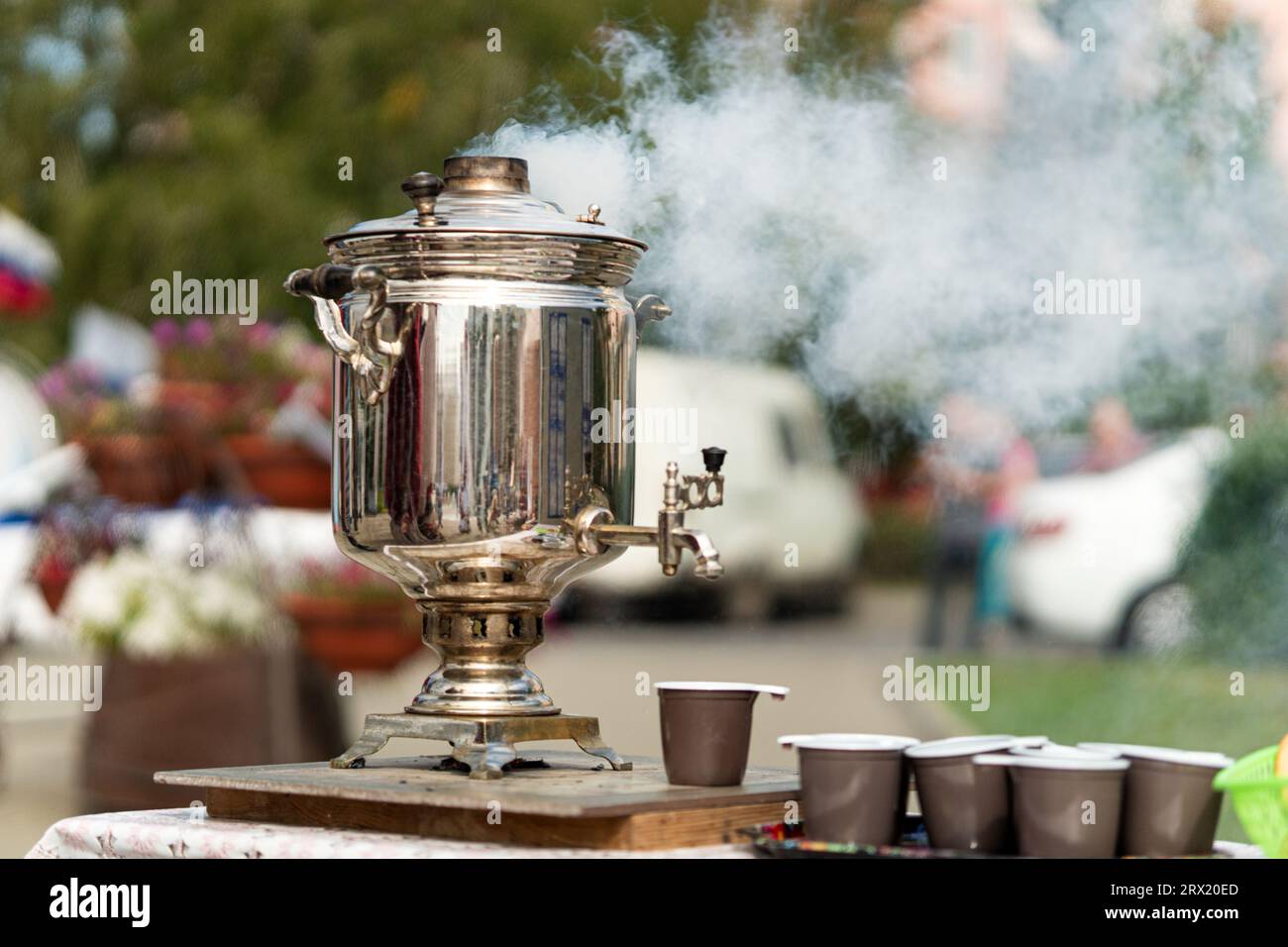 wood burning samovar in nature with smoke. traditional village tea ...