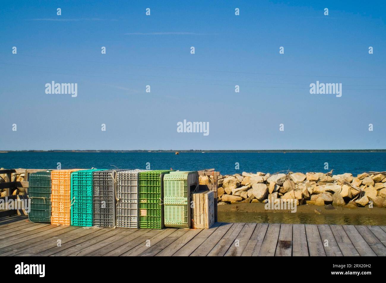 Fish boxes at a jetty in the Po Delta, Veneto, Italy Stock Photo - Alamy