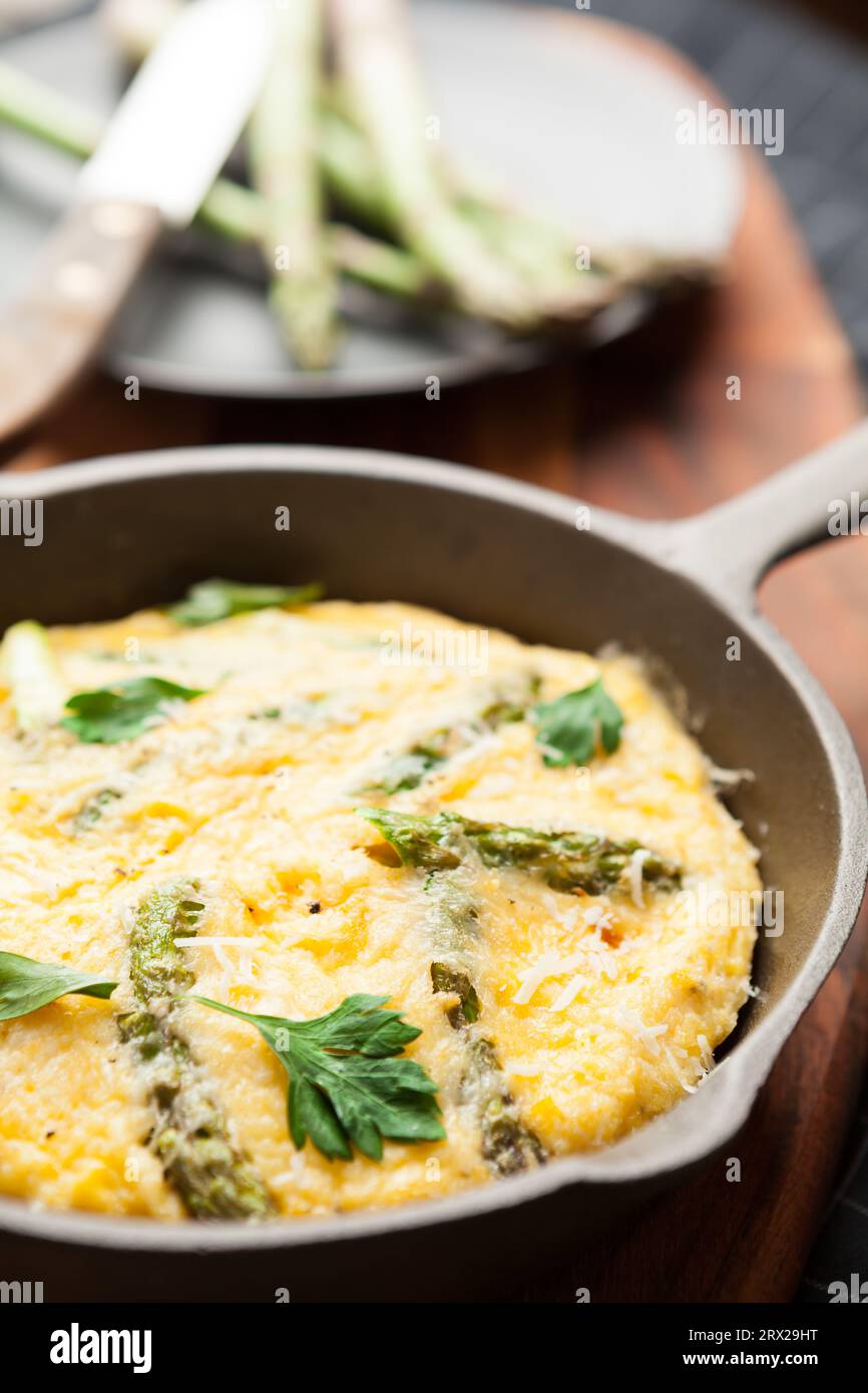 Asparagus frittata with Parma cheese. Spanish dish Stock Photo - Alamy
