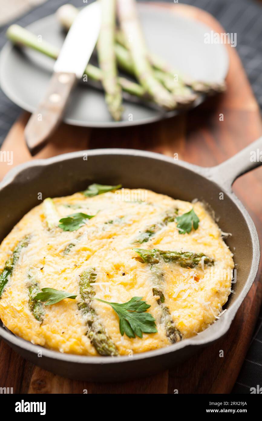 Asparagus frittata with Parma cheese. Spanish dish Stock Photo - Alamy