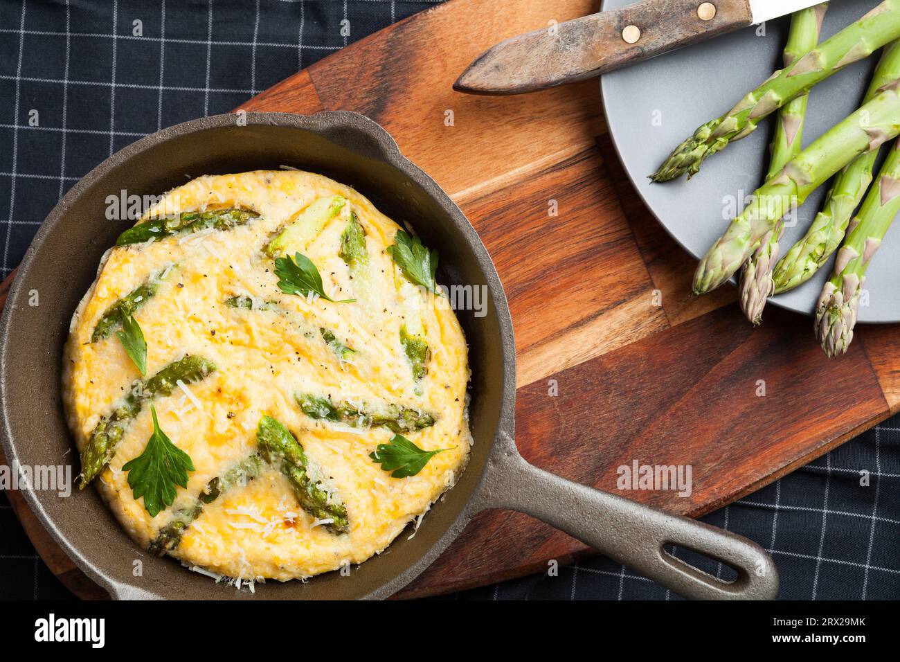 Asparagus frittata with Parma cheese. Spanish dish Stock Photo - Alamy