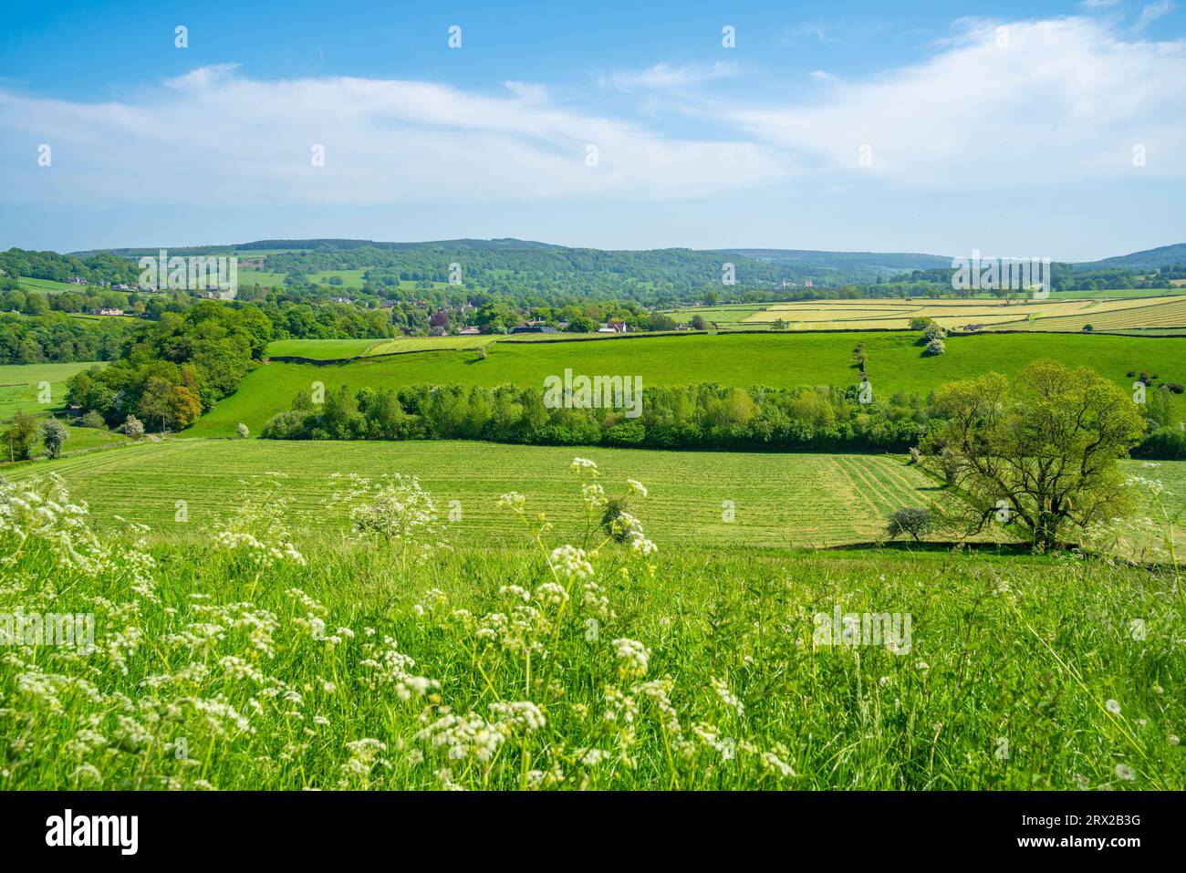 View of farmland and Baslow village during spring, Peak District ...