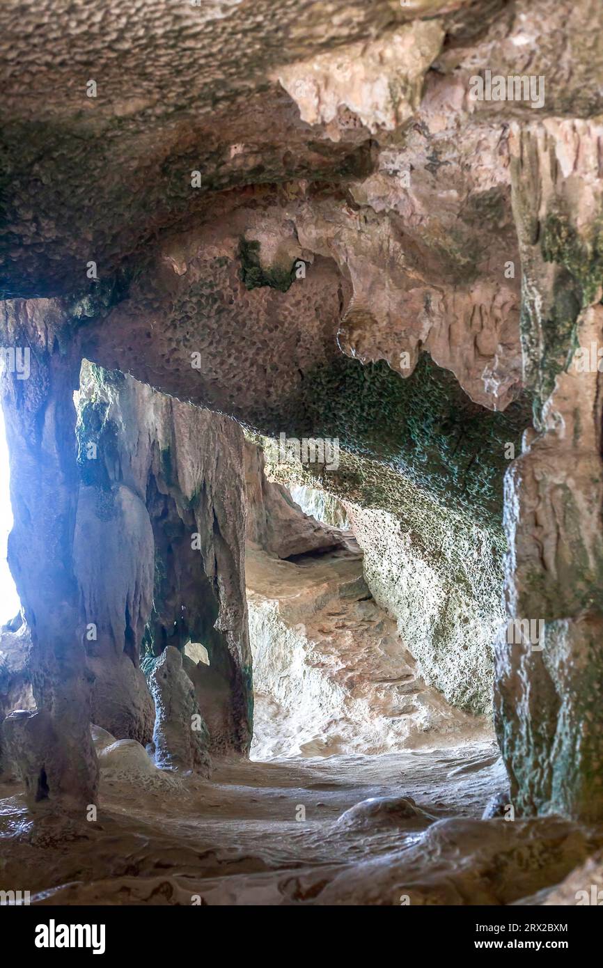 Limestone cave inside and sunlight. Light cavern interior in Thailand ...