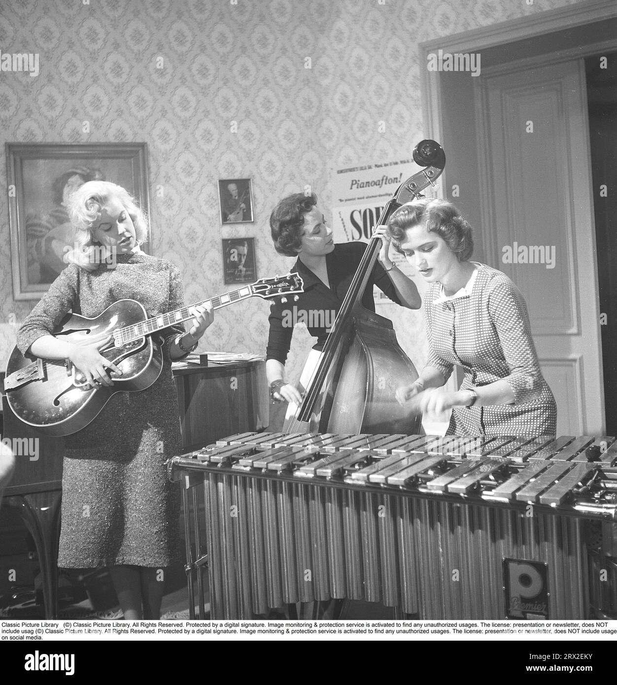 In The 1950s Three Women Play Music Together One Plays Guitar One In The 1950s Three Women Play Music Together One Plays Guitar One