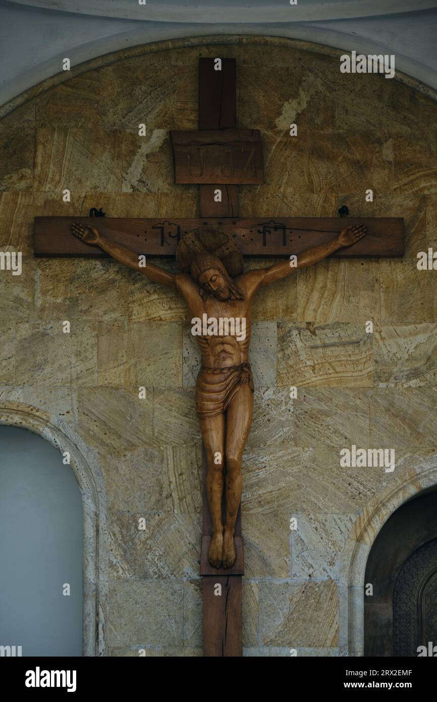 Georgia, Tbilisi - 01.09.2023. A wooden cross with the crucified God ...