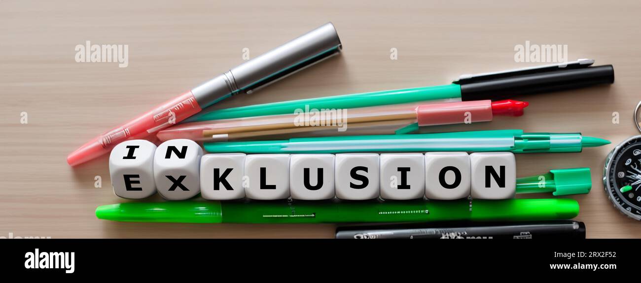 Symbol for a better inclusion. Hand turns dice and changes the word ...