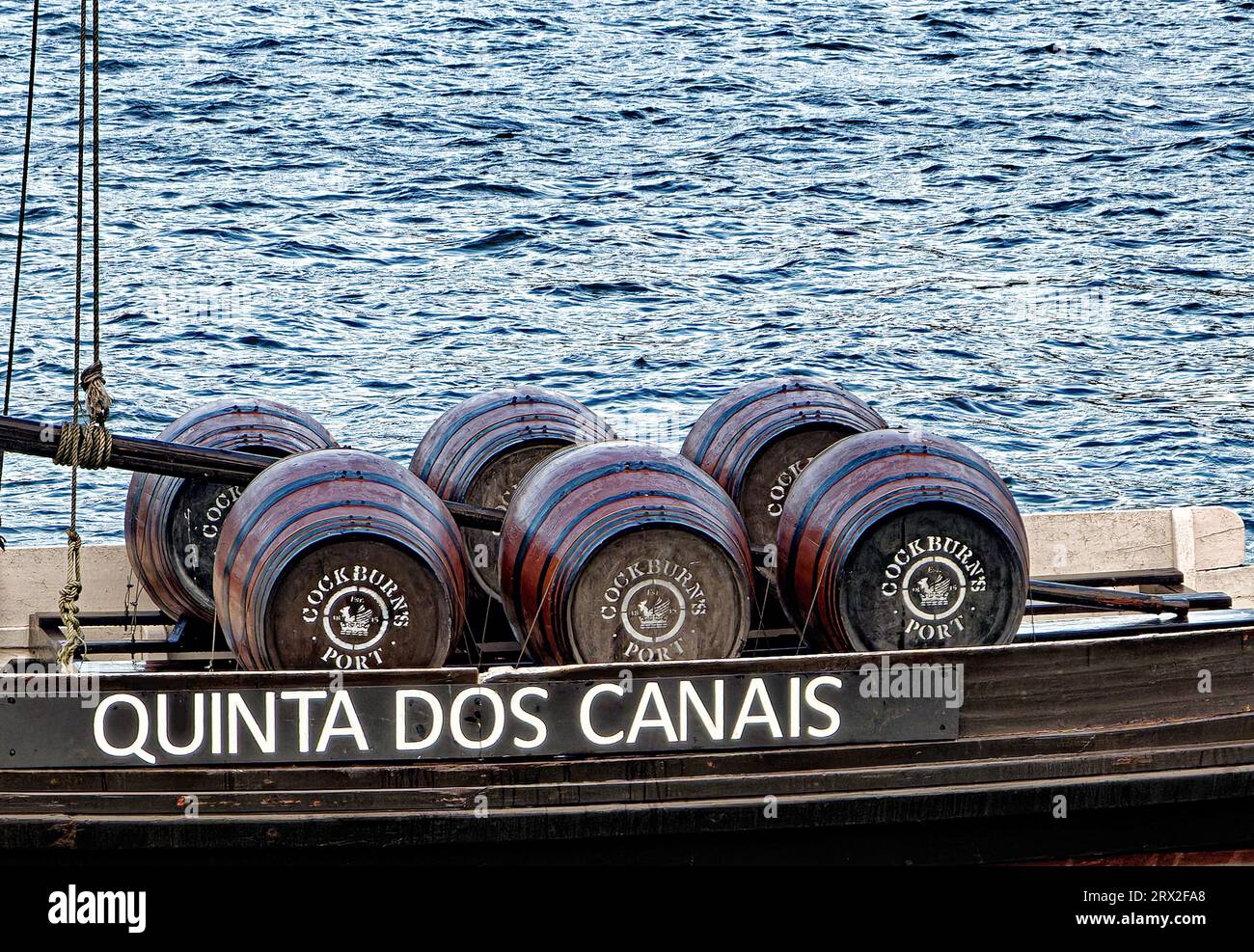 Barrels of fortified wine, Port, on a boat on the River Douro, Porto ...