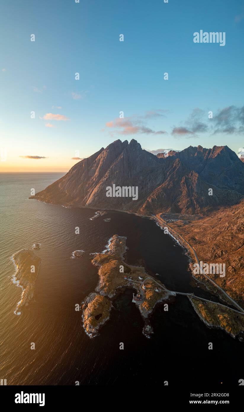 Aerial panoramic view of majestic mountains overlooking the sea at dawn ...