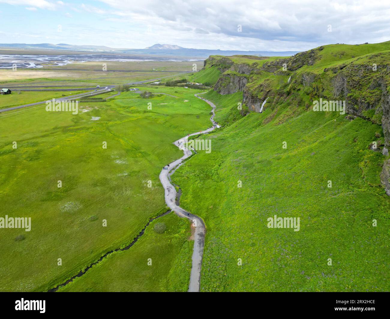 Seljalandsfoss waterfall sorrounded by green grass and moss Stock Photo ...