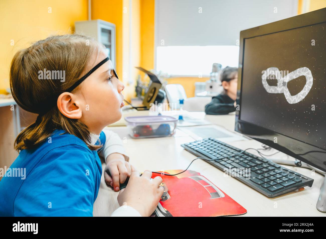 Little girl in medical office undergoing advanced laser vision ...
