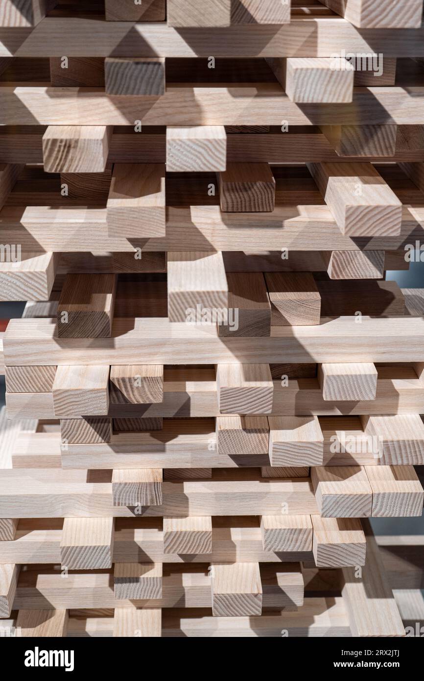 Wooden background. Big constructor from cut wooden blocks. Tower wall ...