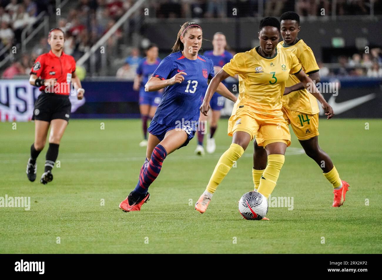 United States' Alex Morgan, center, moves to challenge South Africa's ...