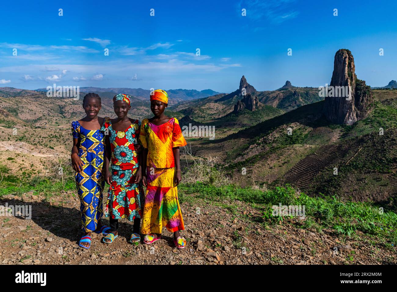 Three Kapsiki tribal girls in front of the lunar landscape, Rhumsiki ...