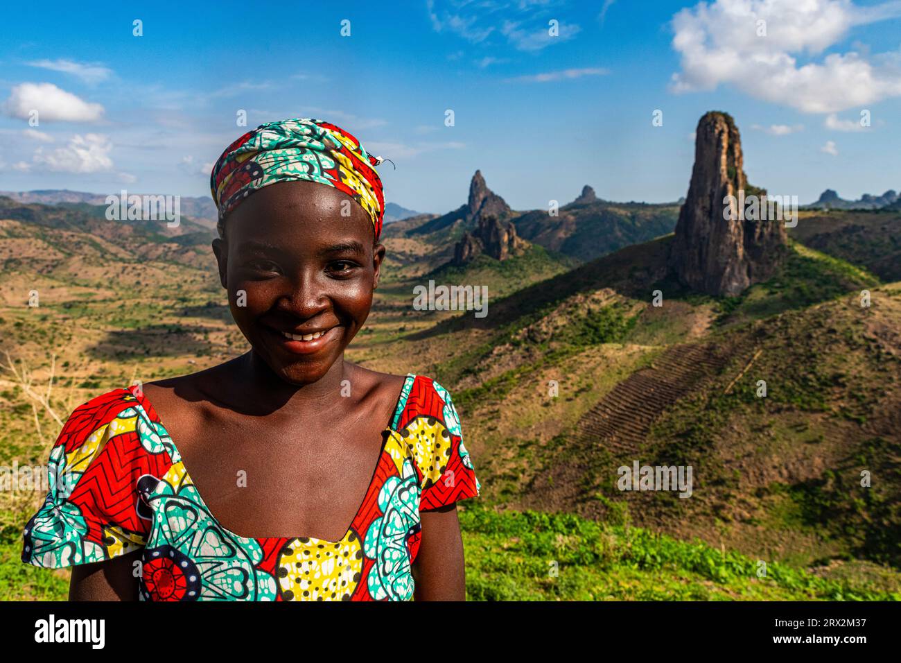 Kapsiki tribal girl in front of the lunar landscape of Rhumsiki ...
