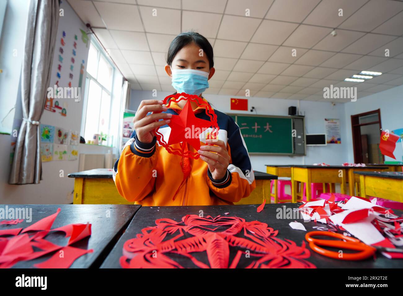 Luannan County, China - October 14, 2022: A little girl is showing her ...