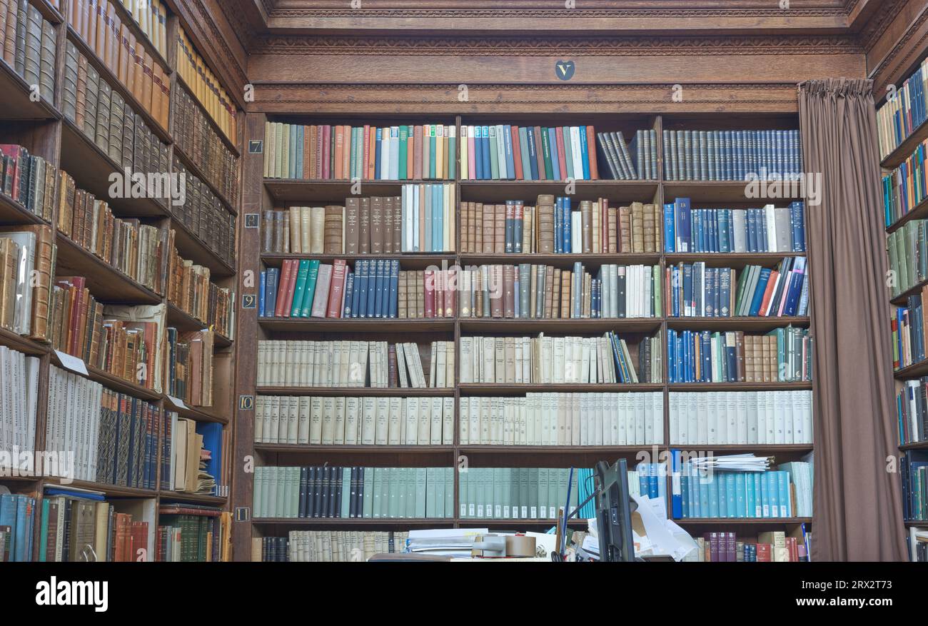 Books in the Wren library at the prestigious college of Trinity at the ...