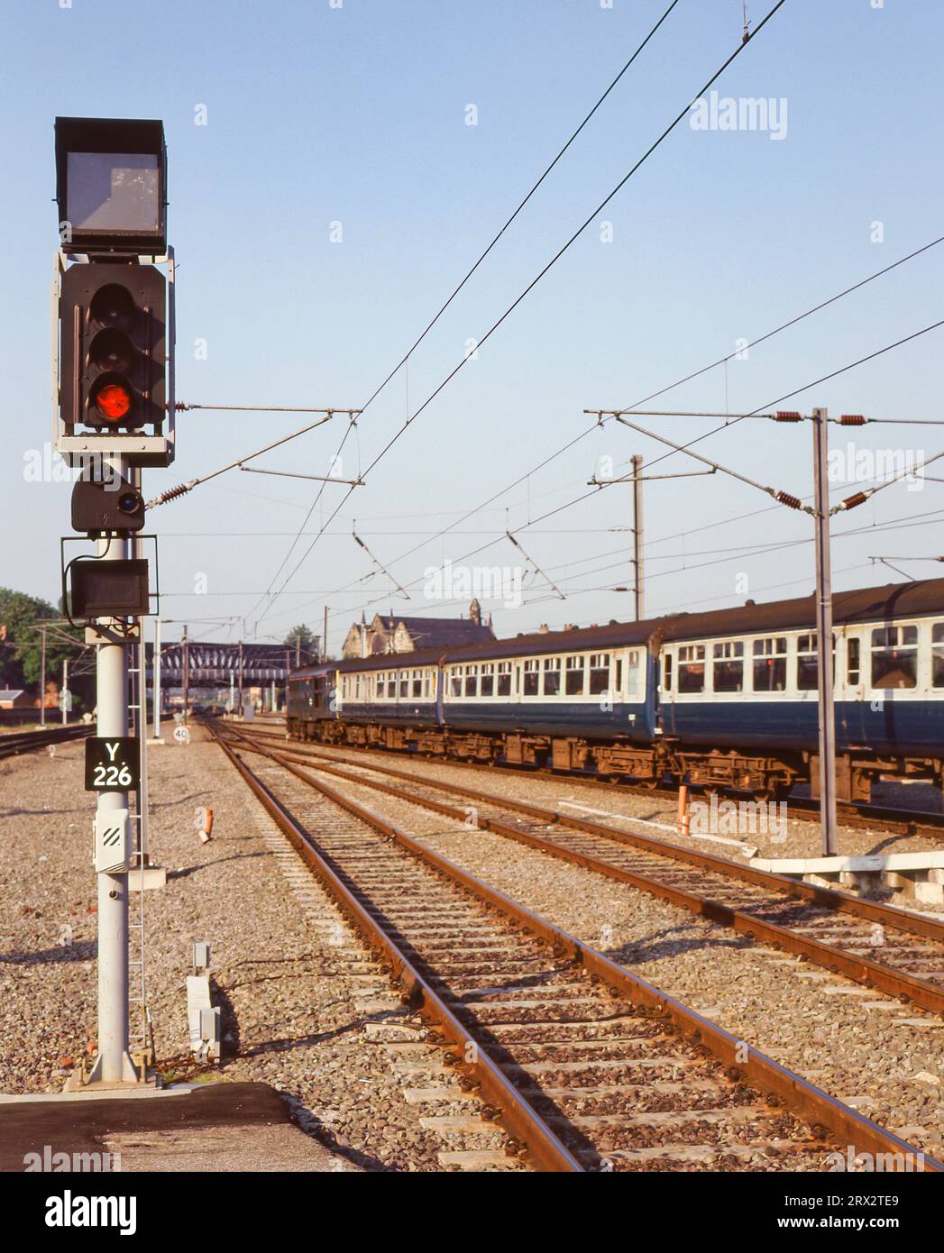 Passenger Train and a red signal Stock Photo - Alamy