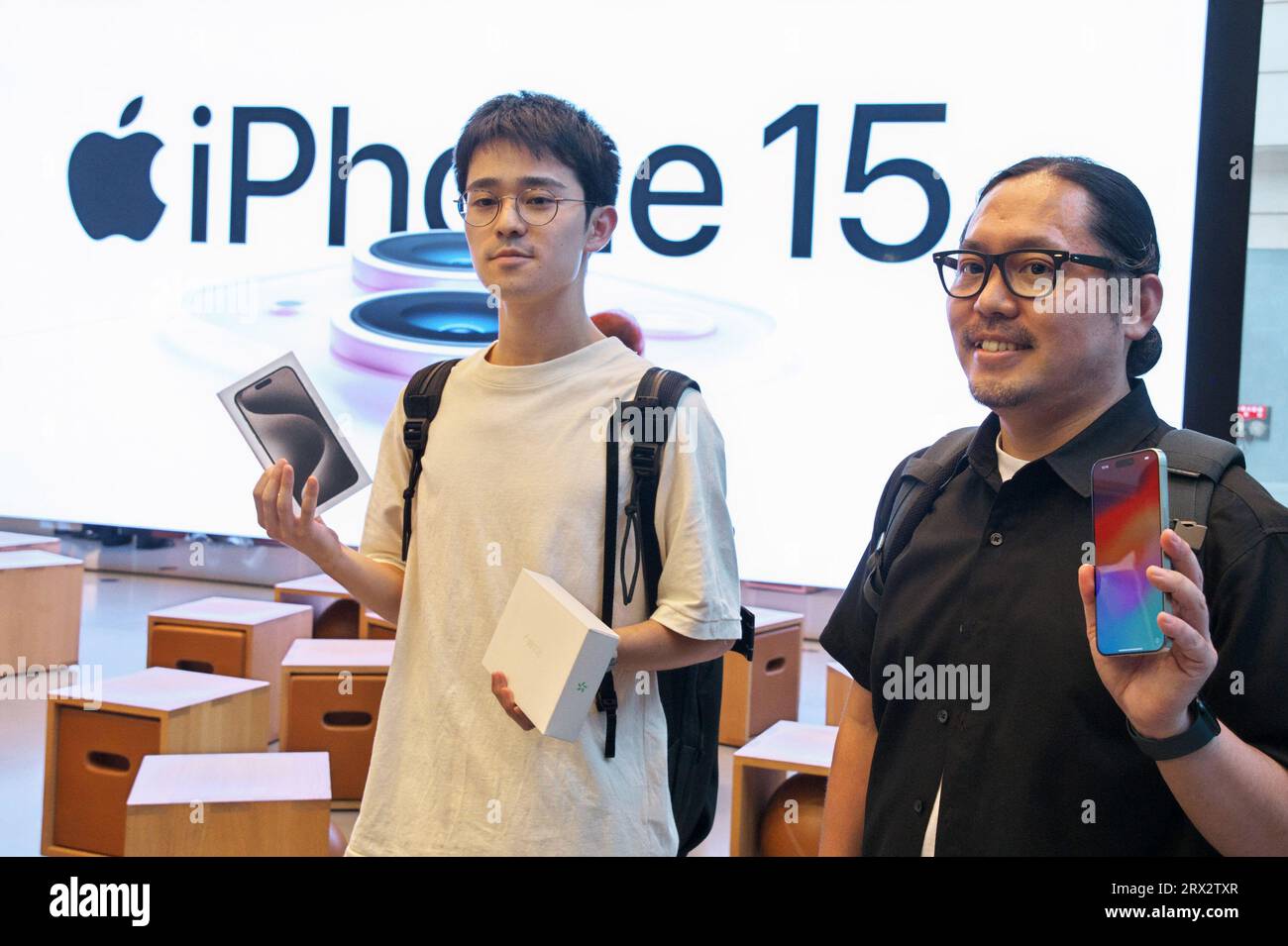 Tokyo, Japan. 22nd Sep, 2023. A customers show off their new iPhone 15 ...
