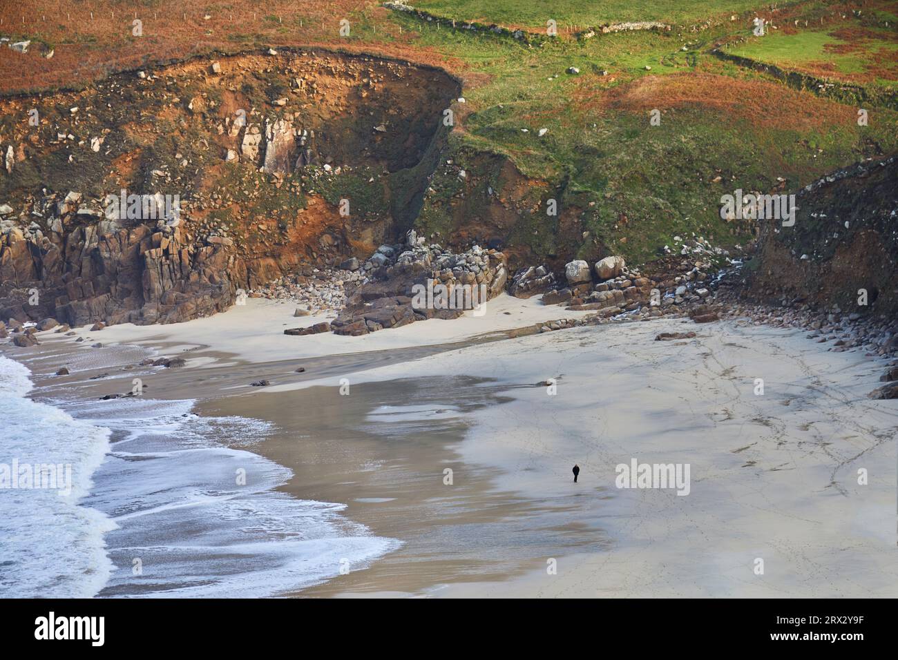 The cliffs and sands of Portheras Cove, a remote beach near Pendeen, on ...