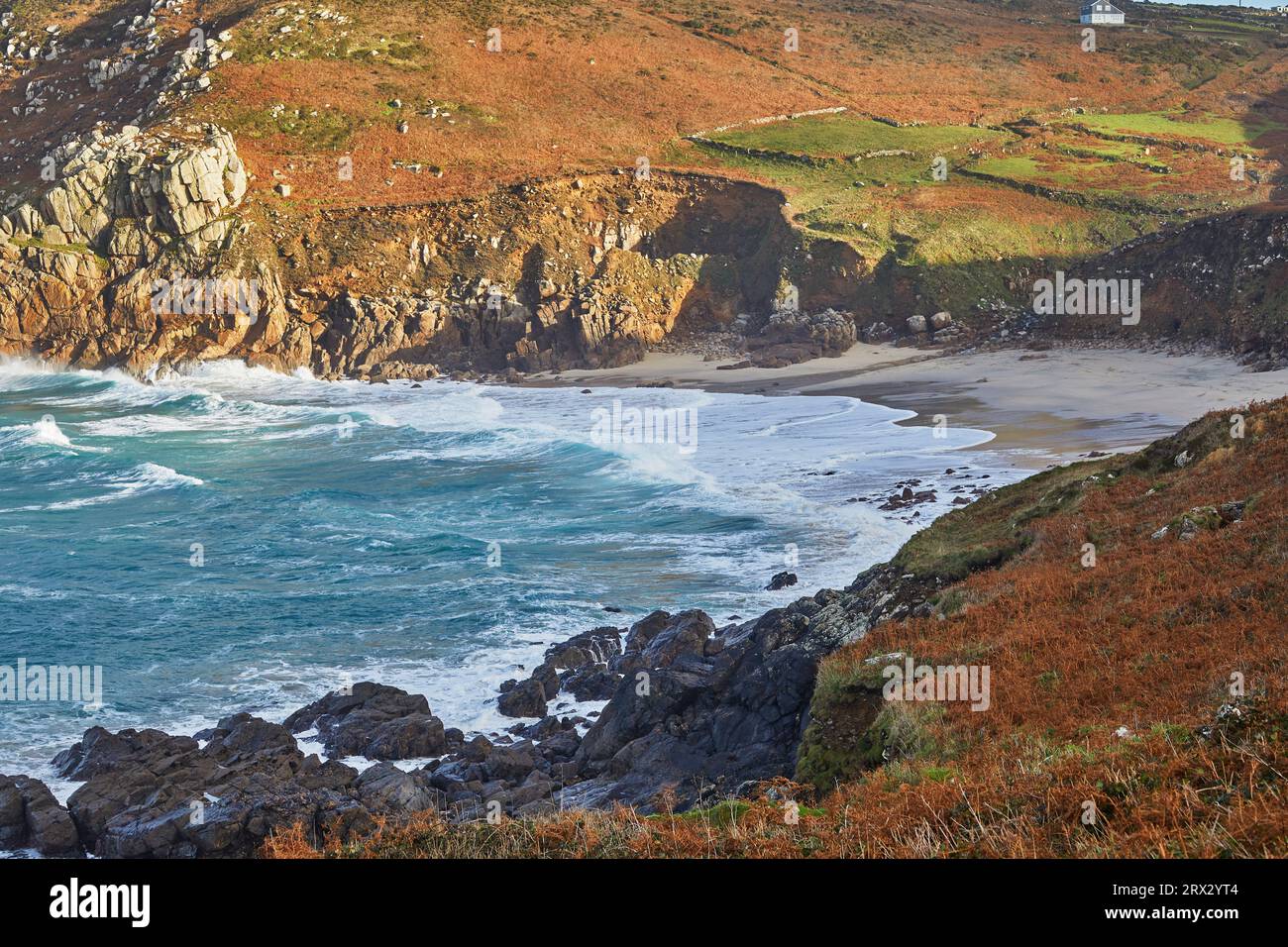The cliffs and sands of Portheras Cove, a remote beach near Pendeen, on ...
