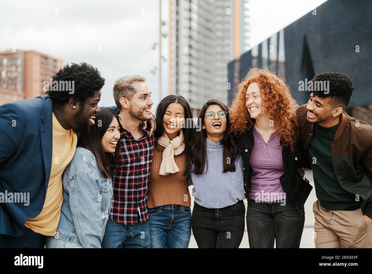 Young multi ethnic friends having fun together hanging out in the city ...