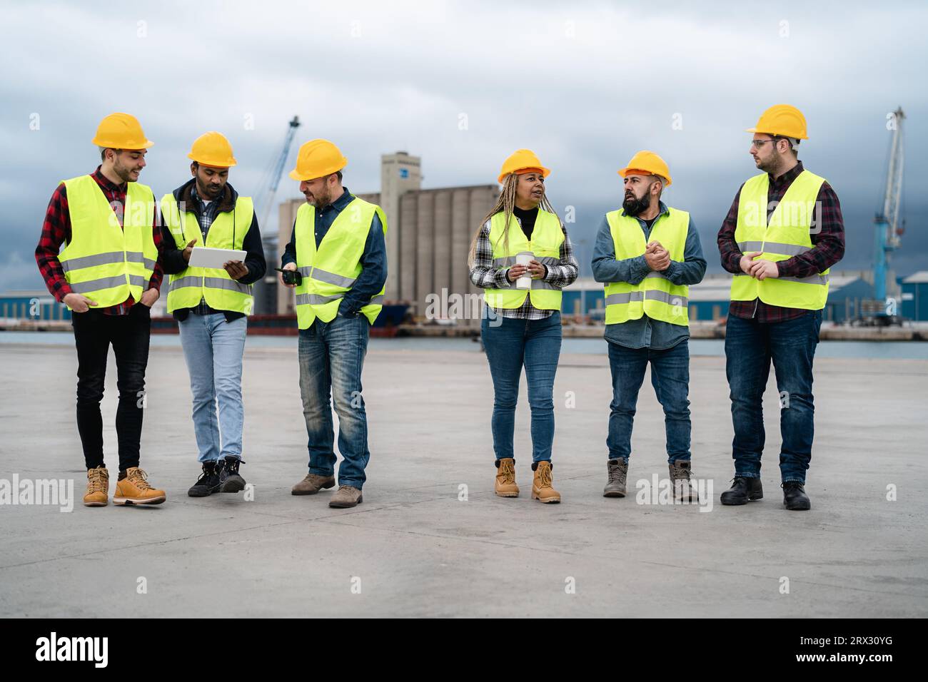 Industrial engineers working in logistic terminal of container cargo ...