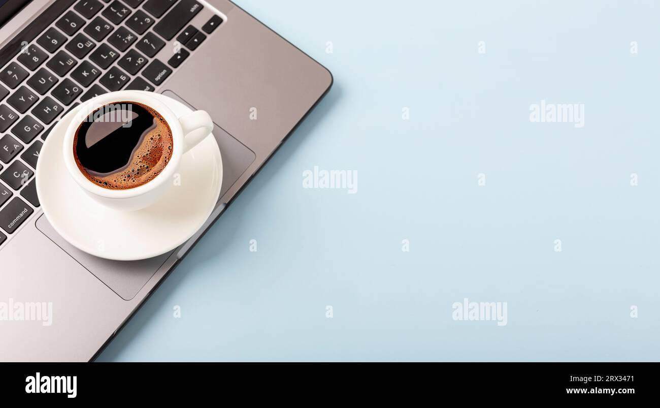 Business desk workplace and office objects over blue backdrop. Top view ...